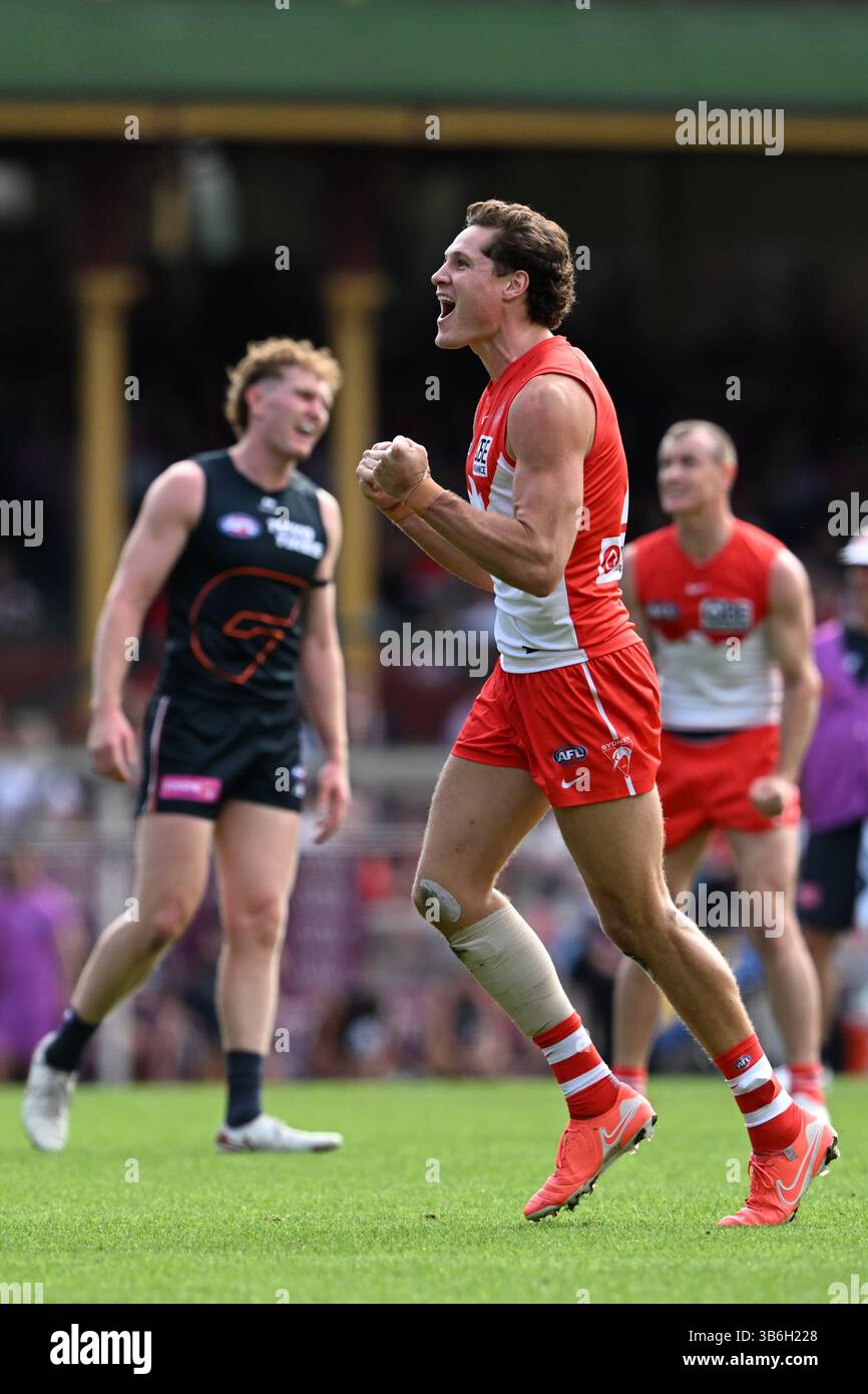 Hayden McLean of the Swans celebrates after kicking a goal during the ...