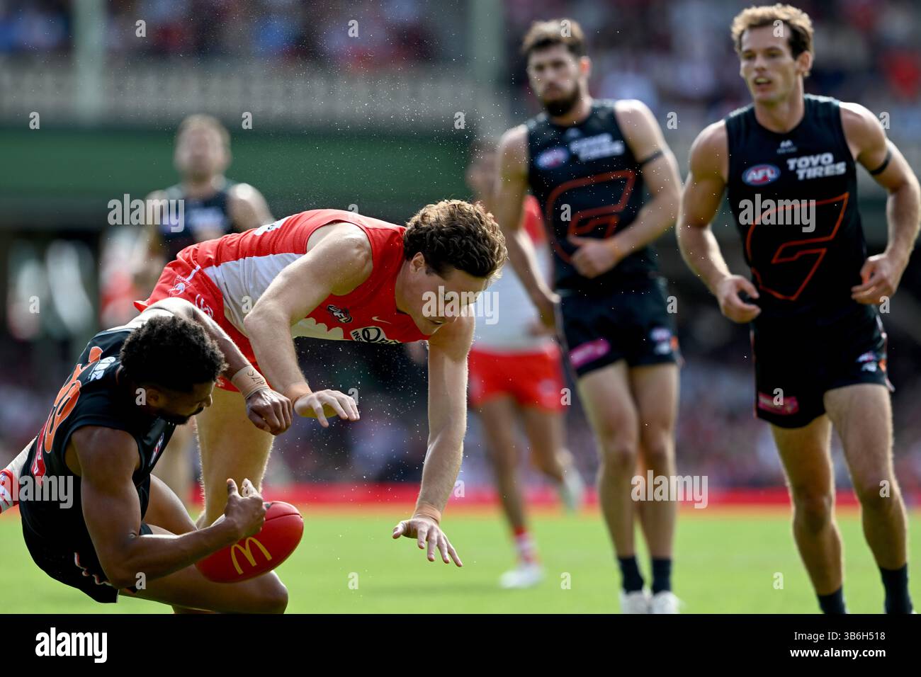 Hayden McLean of the Swans and Connor Idun of the Giants collide during ...
