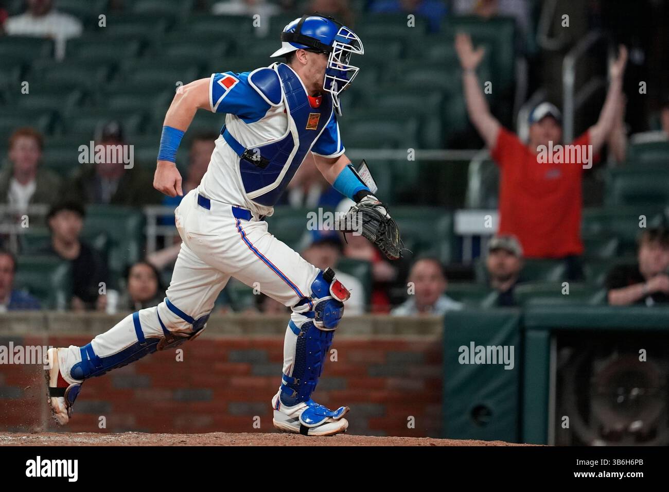 Atlanta Braves catcher Sean Murphy (12) runs for a loose ball in the ...