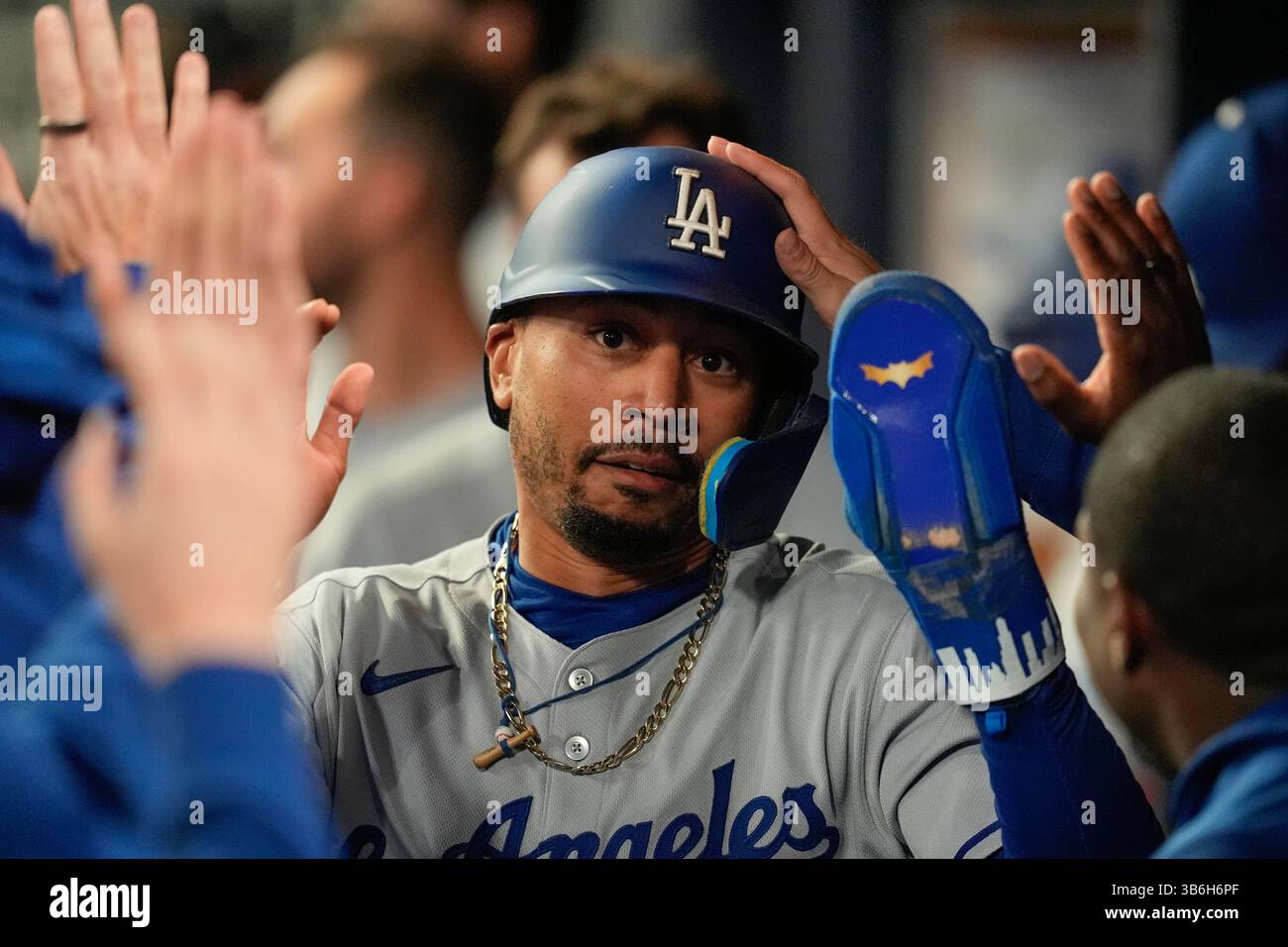 Los Angeles Dodgers' Mookie Betts (50) celebrates scoring off the bat ...