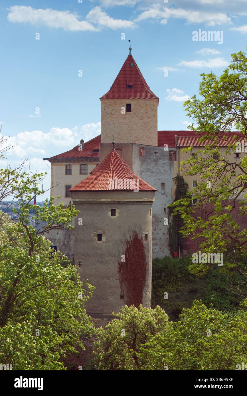 A historical stone castle tower Daliborka and behind it the Black Tower ...
