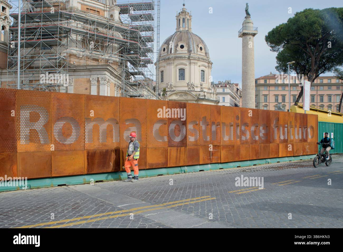 February 16, 2024, Rome, Italy: A worker walks in front of the fence of ...