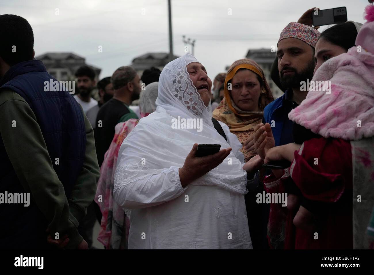 A Kashmiri Muslim woman pilgrim weeps as the first batch departs for ...
