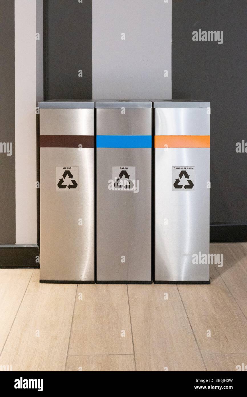 Recycling bins positioned in a modern interior space in Penang Stock ...