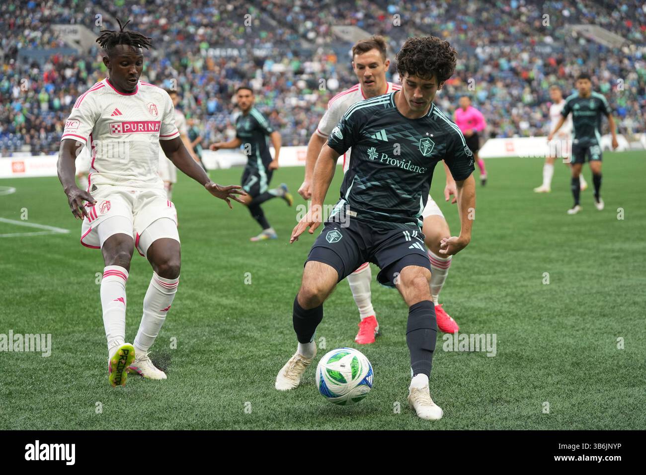 Seattle Sounders FC forward Paul Rothrock (14) shields the ball from St ...