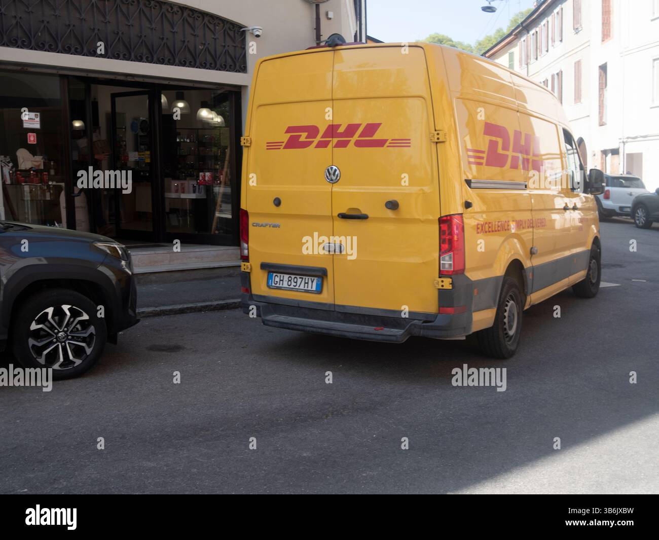 Cremona, Italy - April 12th 2025 DHL Back View of a Yellow Volkswagen ...