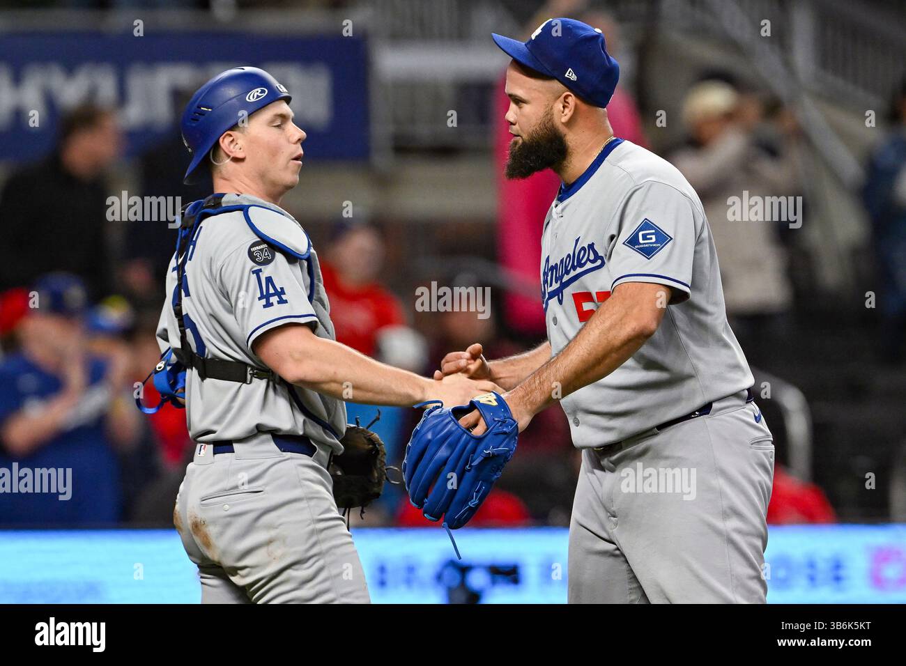 ATLANTA, GA – MAY 03: Los Angeles catcher Will Smith (16) congratulates ...