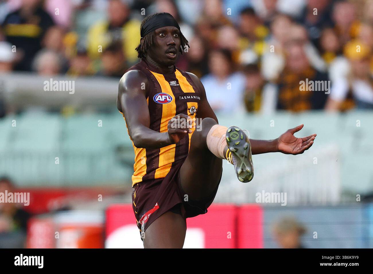 Melbourne, Australia. 04th May, 2025. Mabior Chol of the Hawks kicks ...