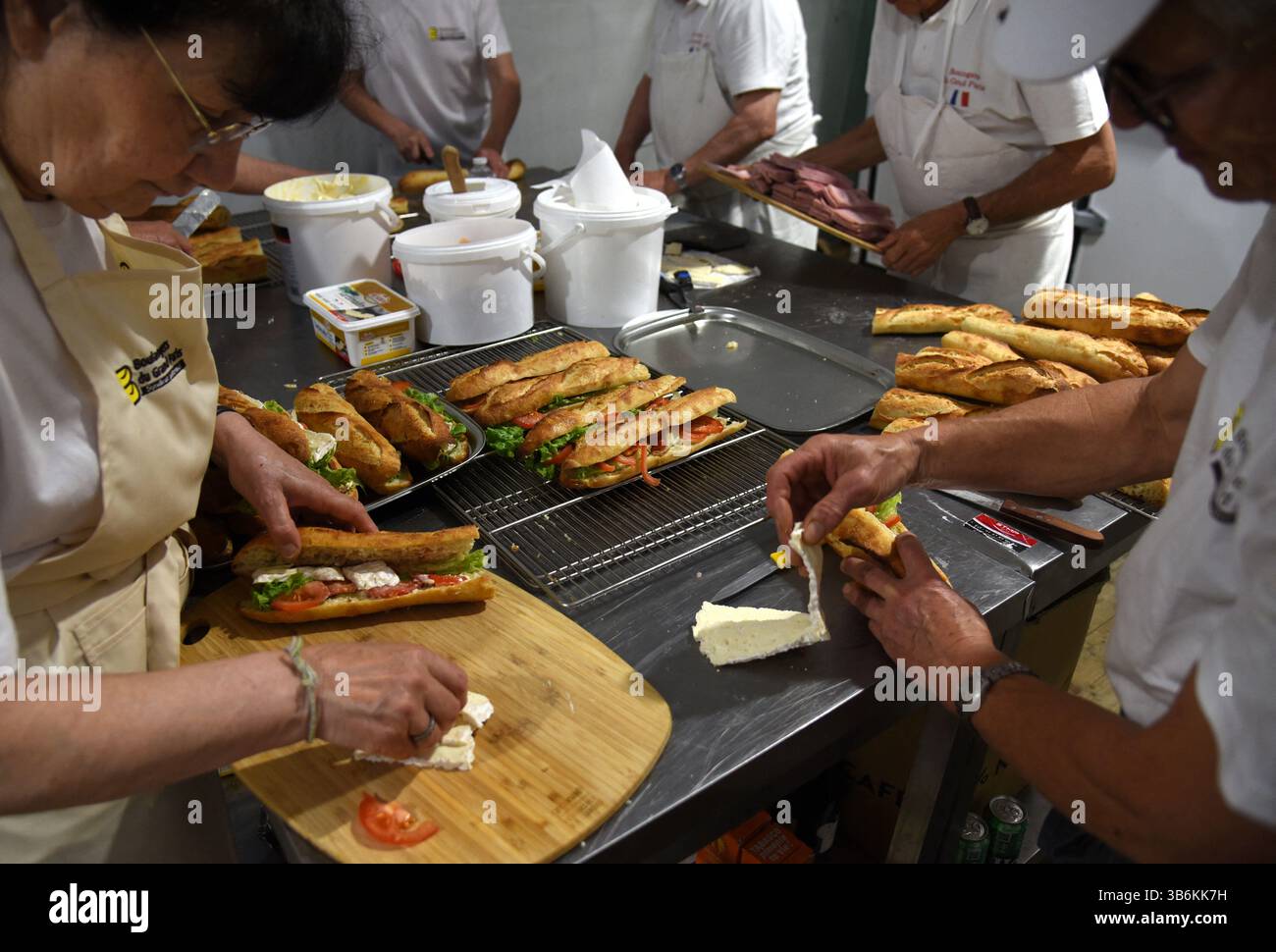 Paris, France. 02nd May, 2025. A baker prepares sandwichs during the ...