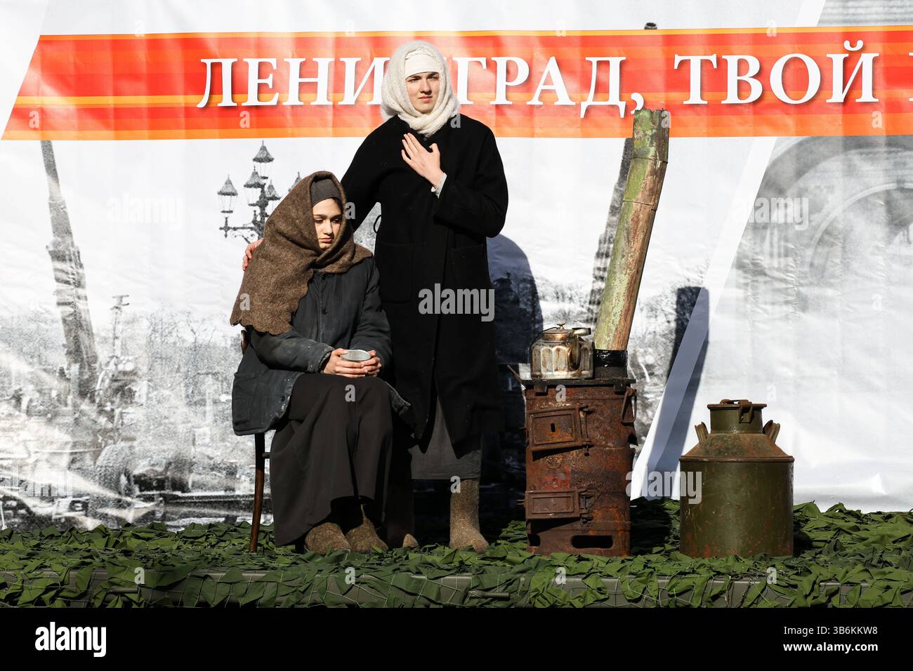 People in Soviet-era clothing demonstrate an installation of Soviet ...