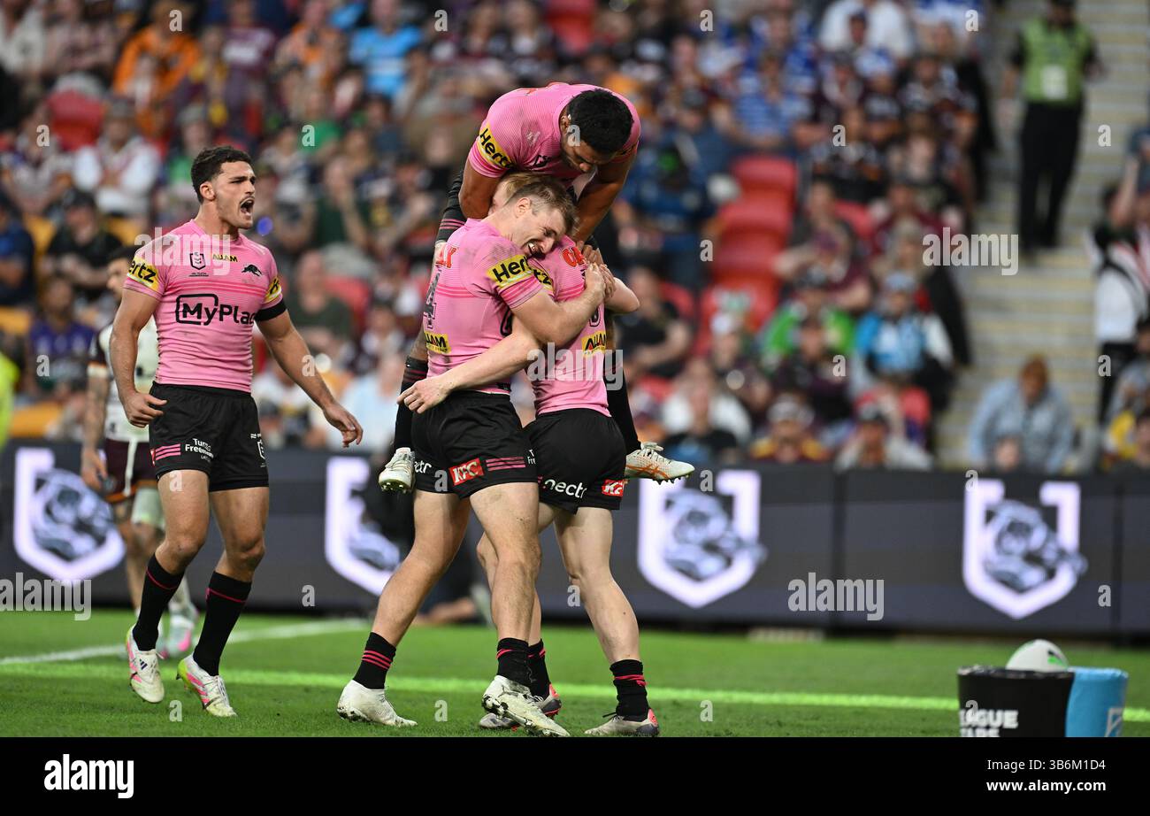 Brisbane, Australia. 04th May, 2025. Nathan Cleary (left) reacts following a try by Thomas ...
