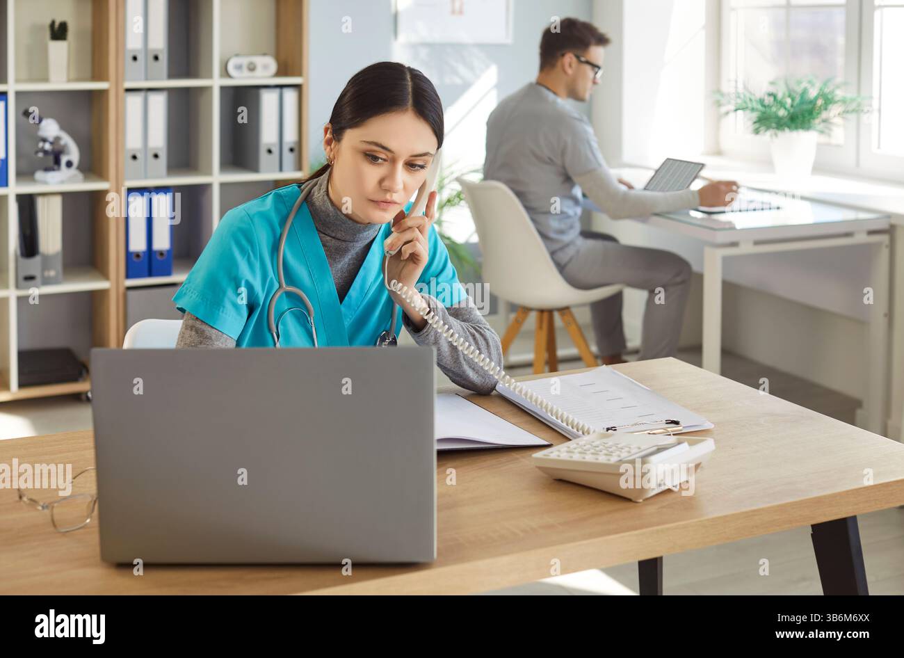 Physician nurse answering patient call hi-res stock photography and ...