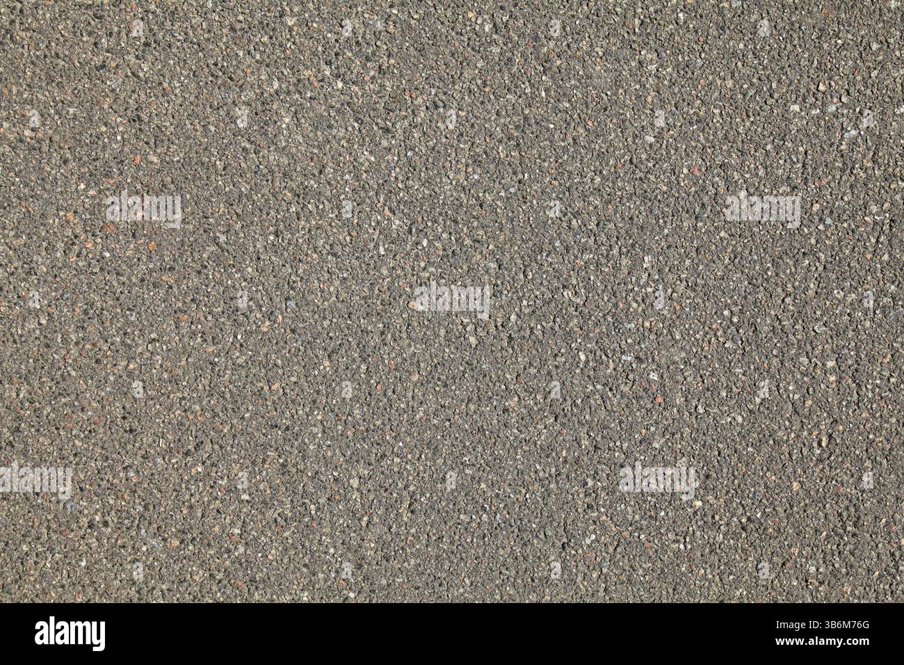 An old, faded asphalt surface, background. Detailed texture of the ...
