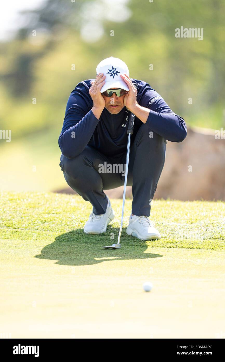 Co-Captain Henrik Stenson of Majesticks GC reads his putt on the 15th ...