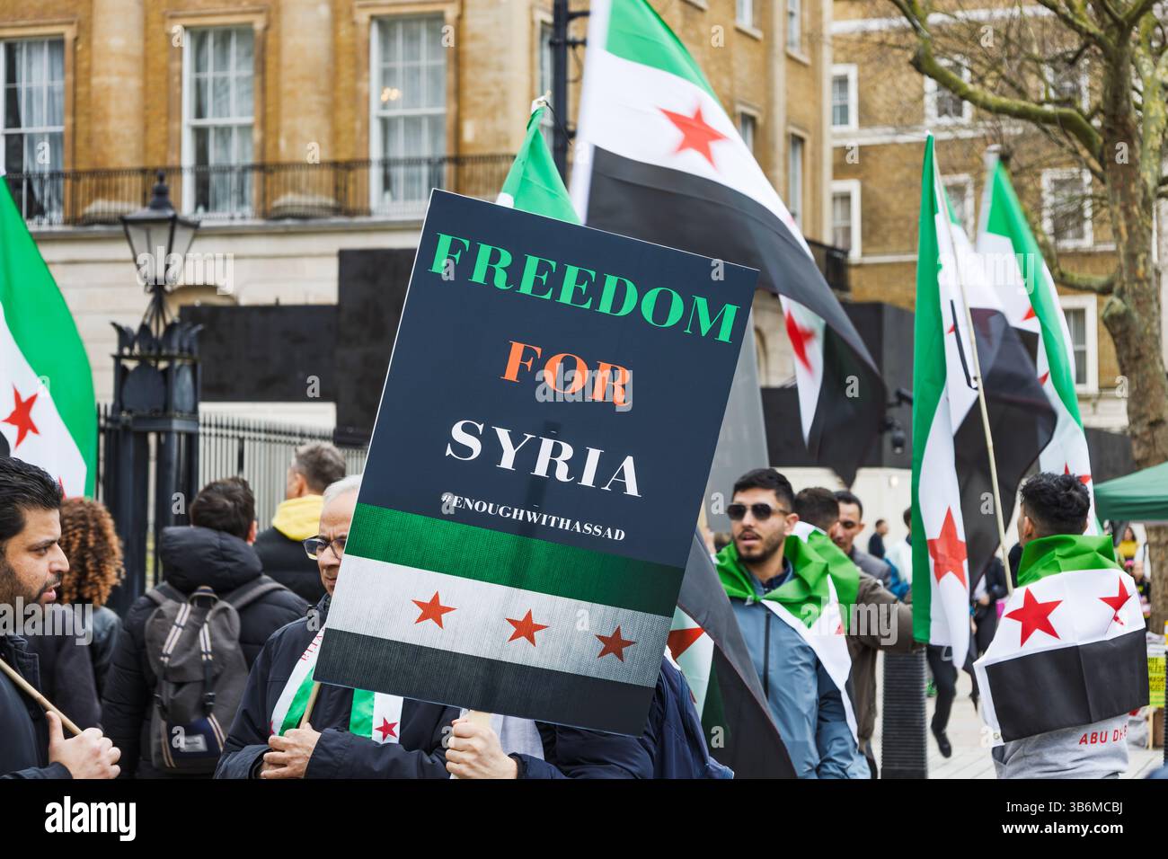 Freedom for Syria activists holding signs and flags during protest ...