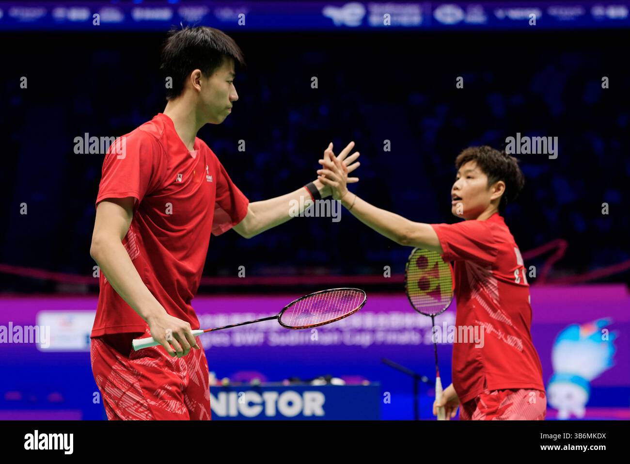 China's Feng Yan Zhe, left, celebrates with his teammate Huang Dong ...