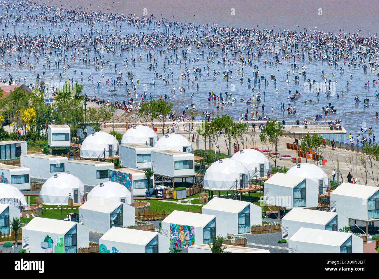 Tianjin. 3rd May, 2025. An aerial drone photo shows tourists have fun ...