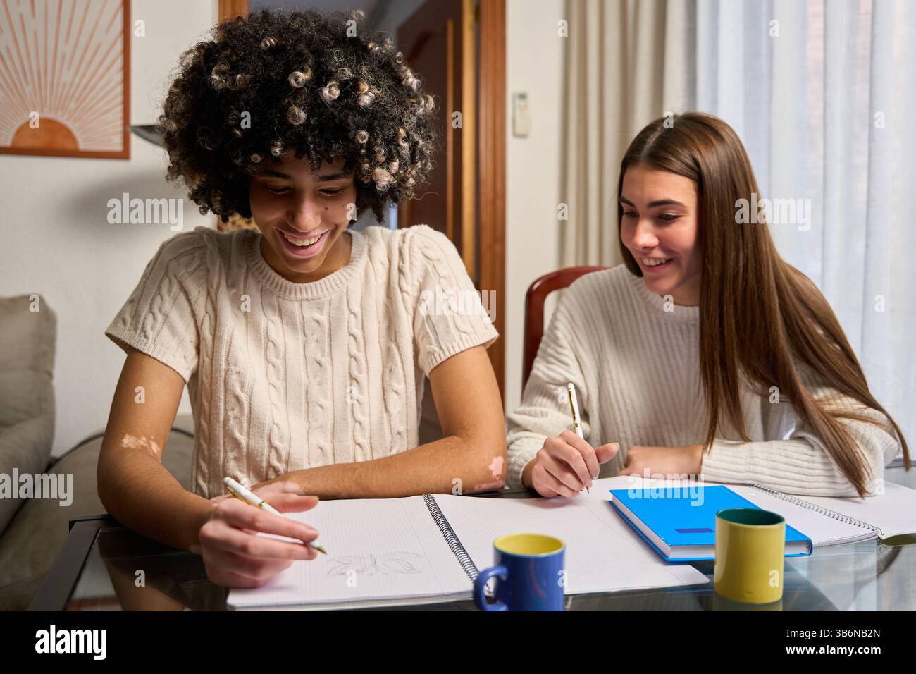 University students collaborating on project at home, sharing ideas and ...