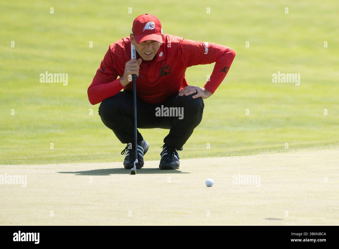 Captain Sergio Garcia of Fireballs GC reads his putt on the third green ...