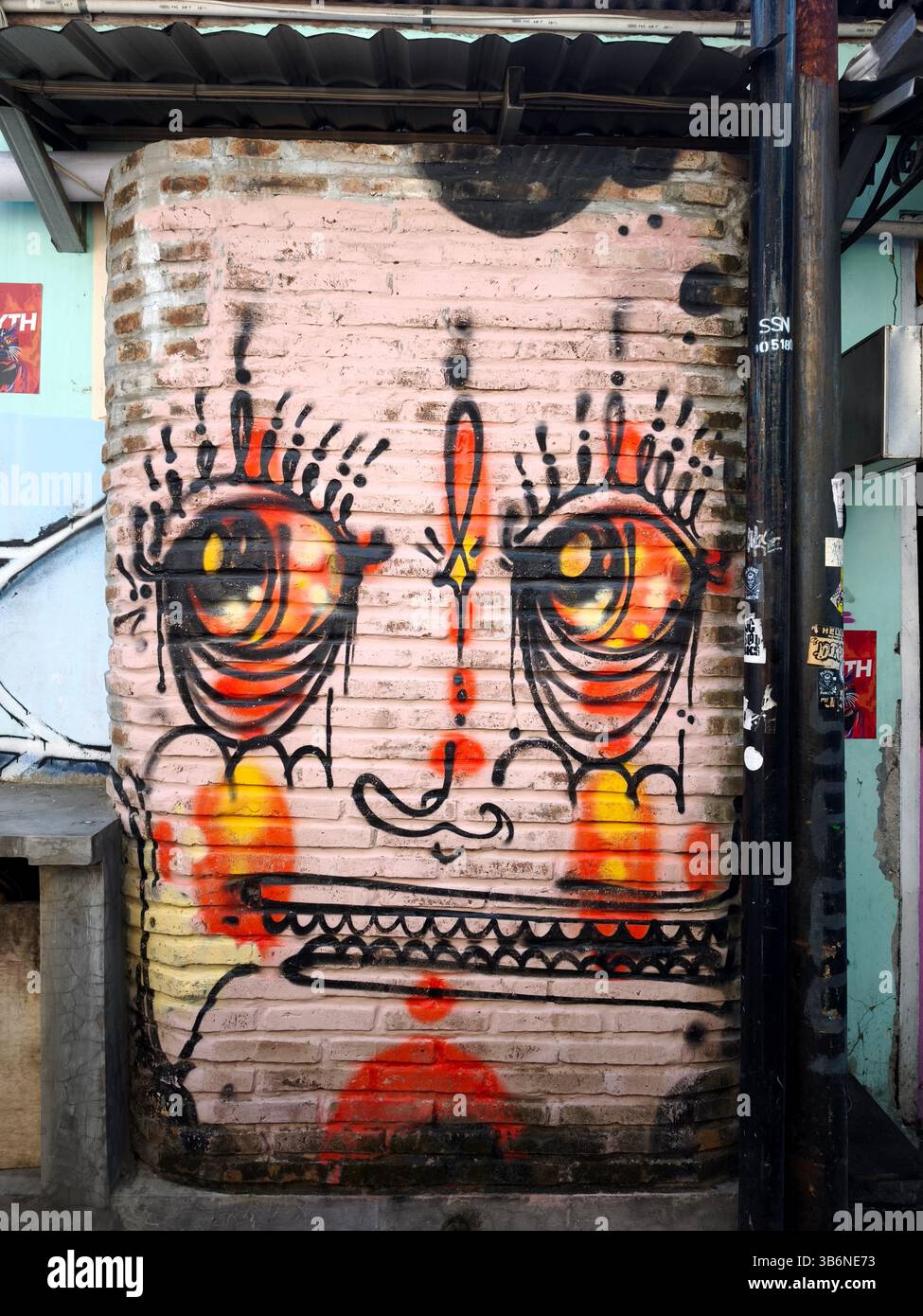 A mural work on a brick wall Stock Photo - Alamy