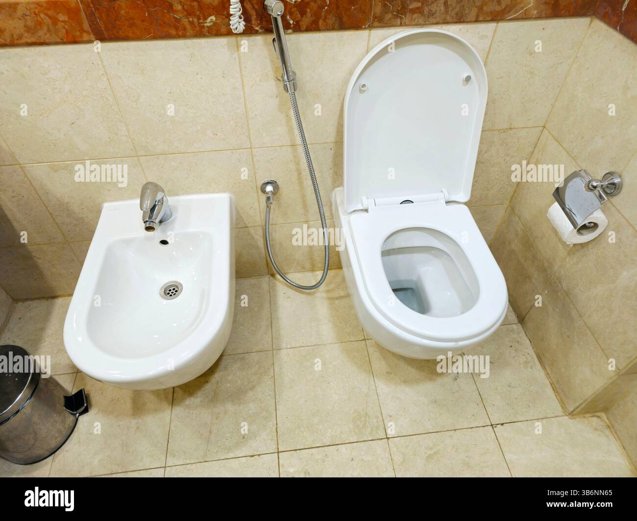 toilet, a piece of sanitary hardware that collects human waste (urine ...