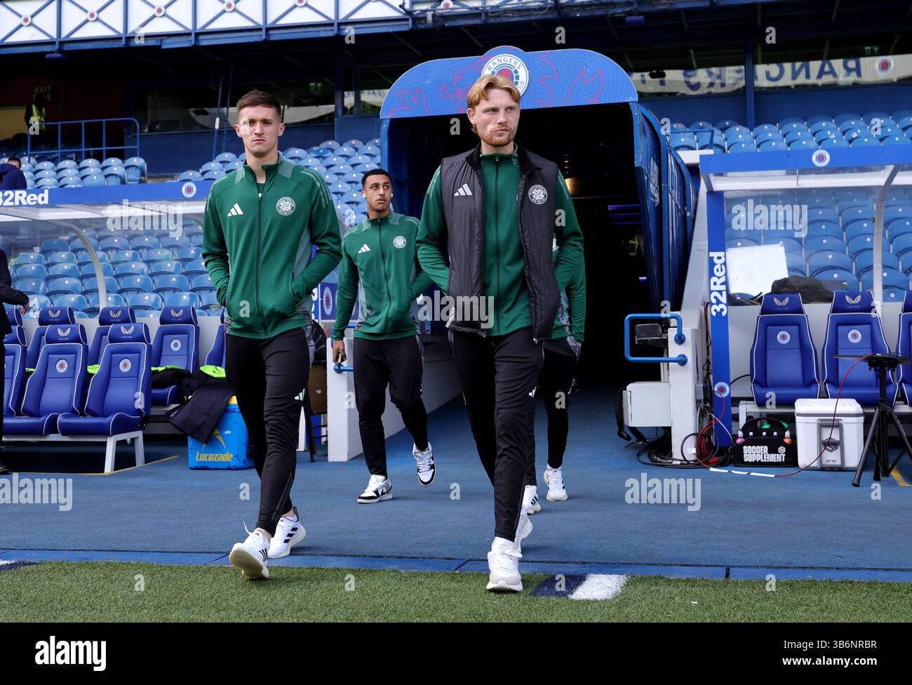 Celtic's Johnny Kenny (left) and Liam Scales walk out onto the pitch ...