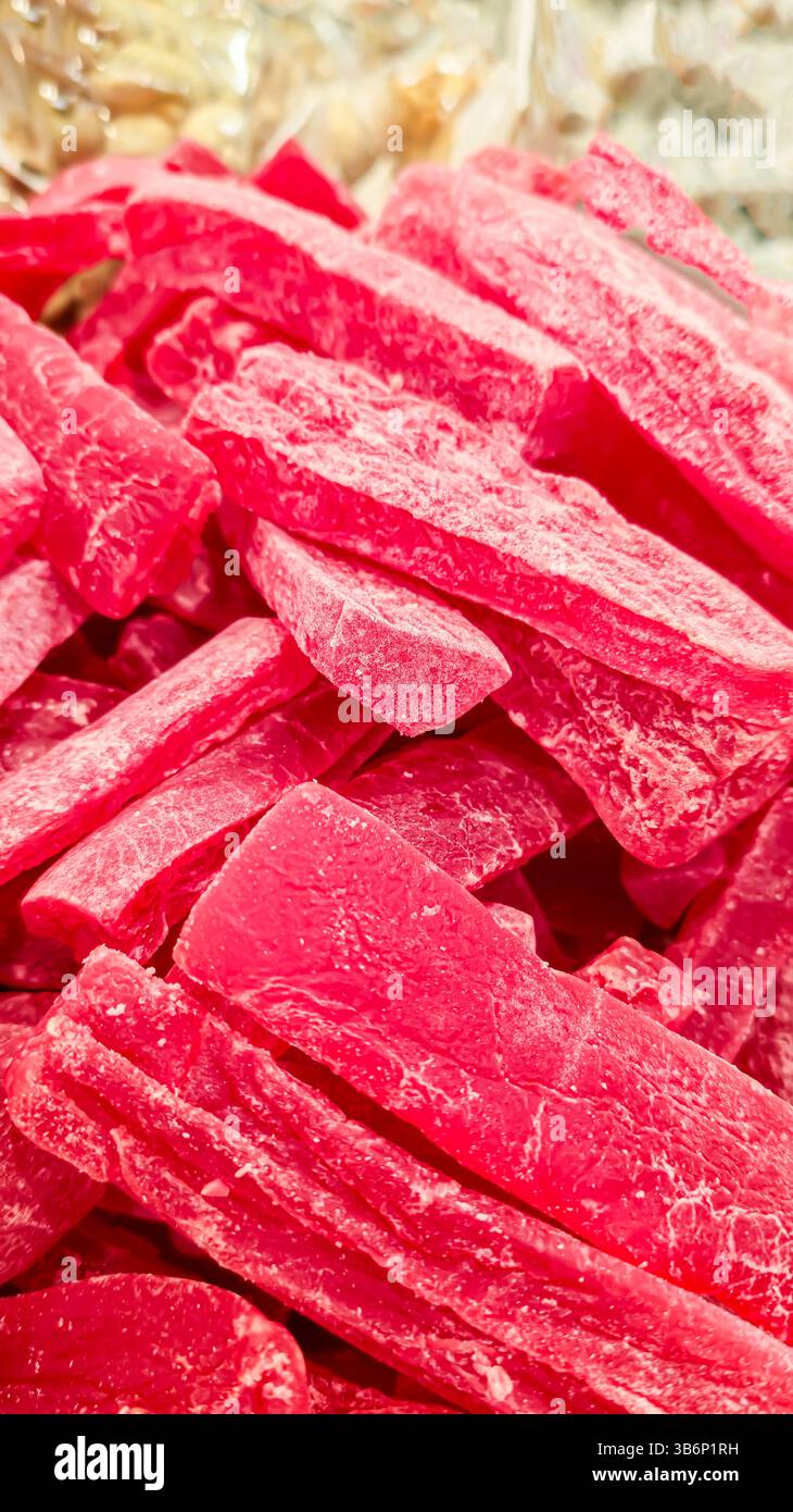 Dried mango strips lie on the counter in a supermarket. Prepared for ...