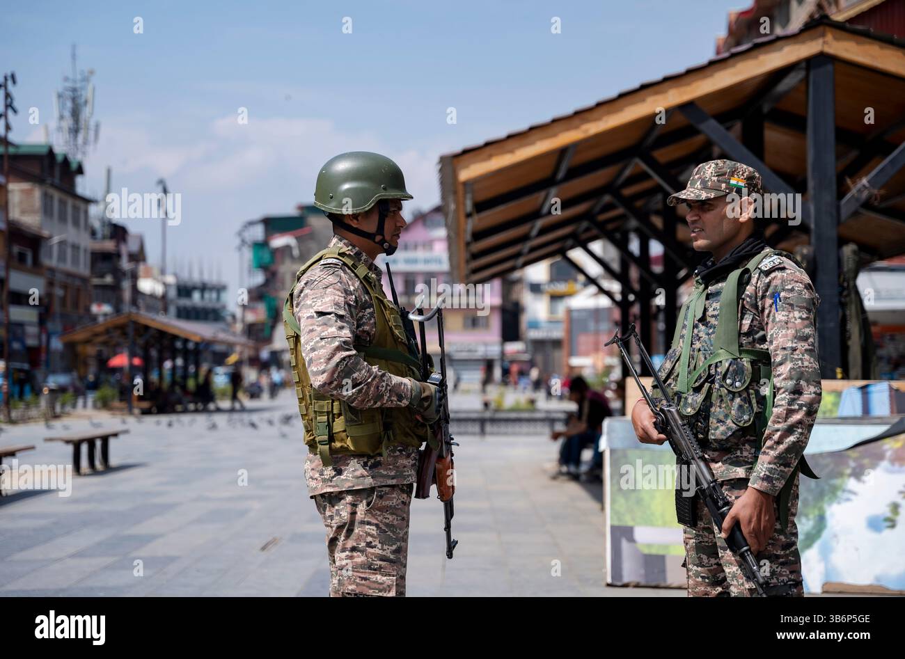 Indian forces stand guard on a street in Srinagar. Tensions between ...