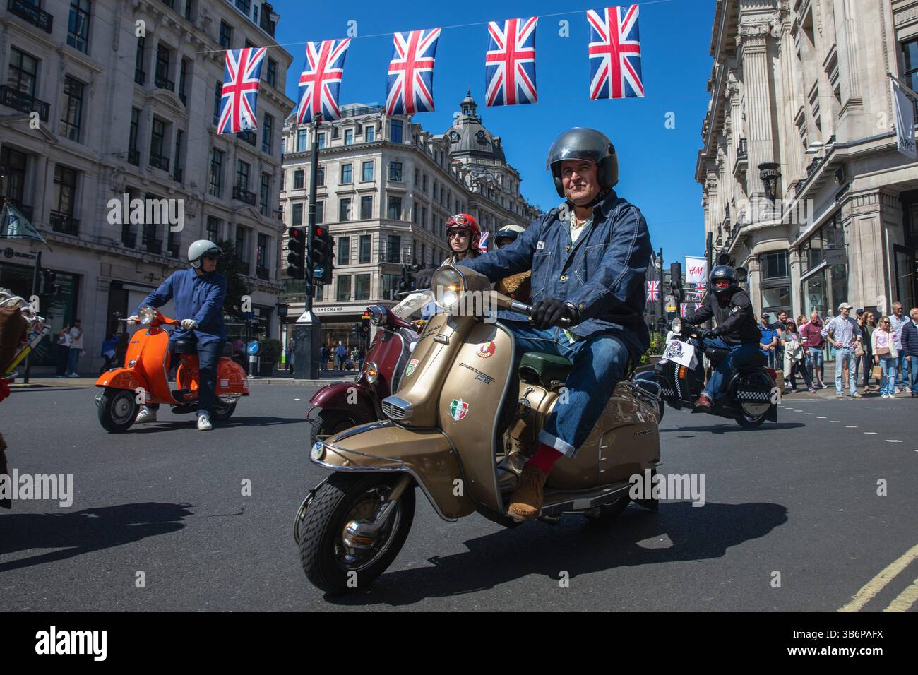 London, UK. 03rd May, 2025. Mods riding classic scooters ride through ...