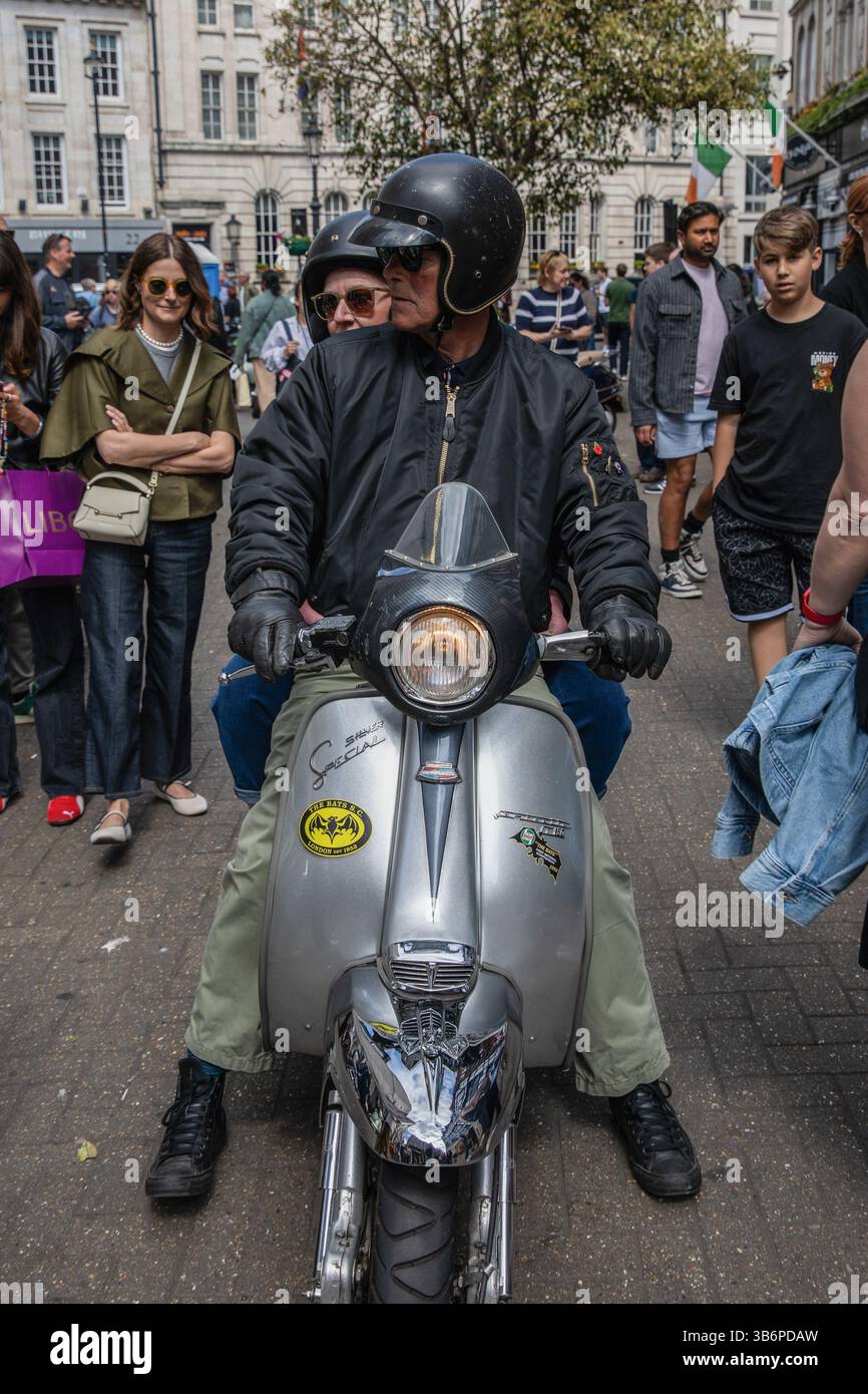 London, UK. 03rd May, 2025. A Mod rides a classic scooter through a ...