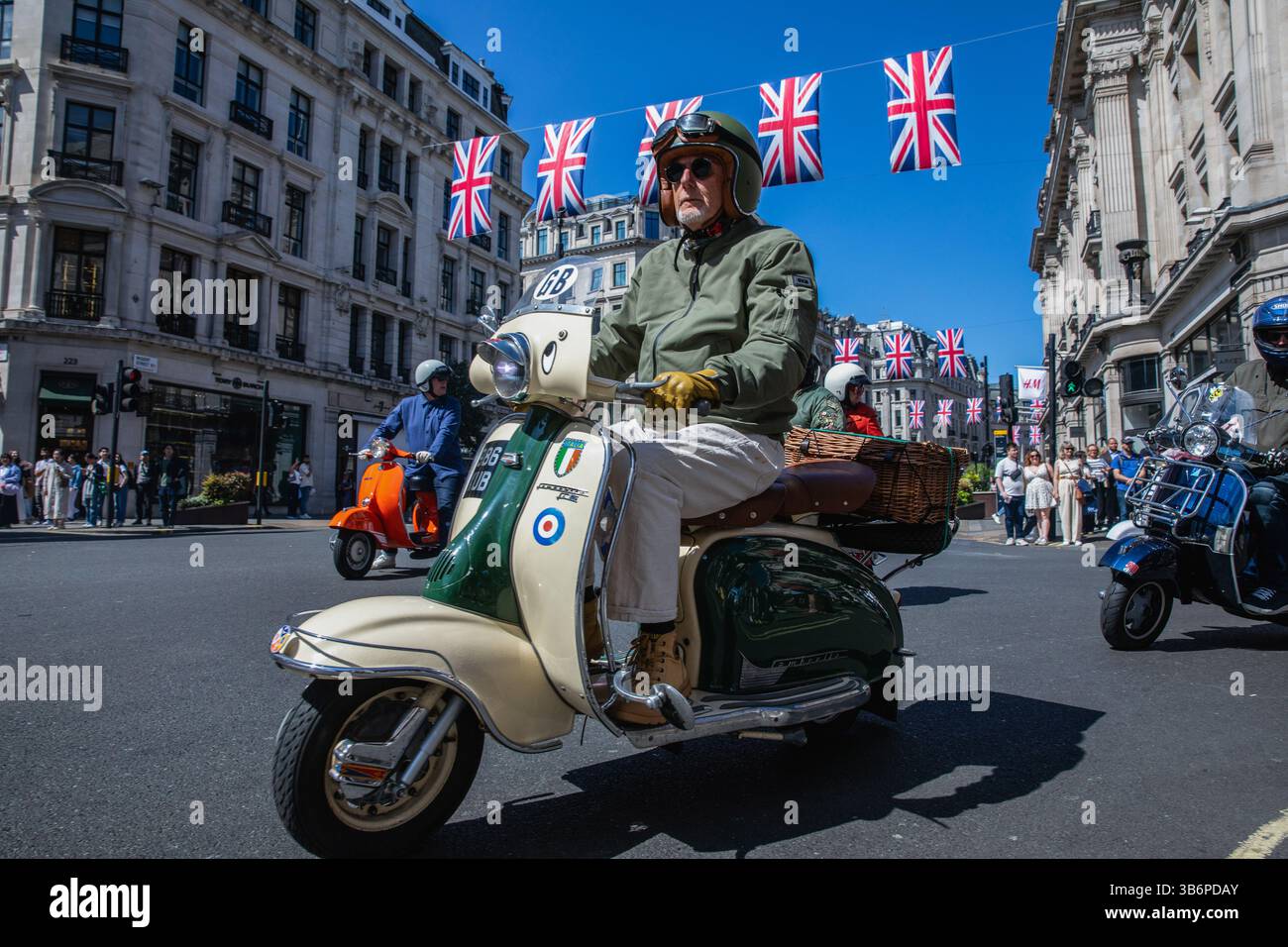 London, UK. 03rd May, 2025. Mods riding classic scooters ride through ...