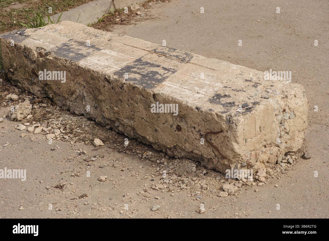 Concrete block lying on the road Stock Photo - Alamy