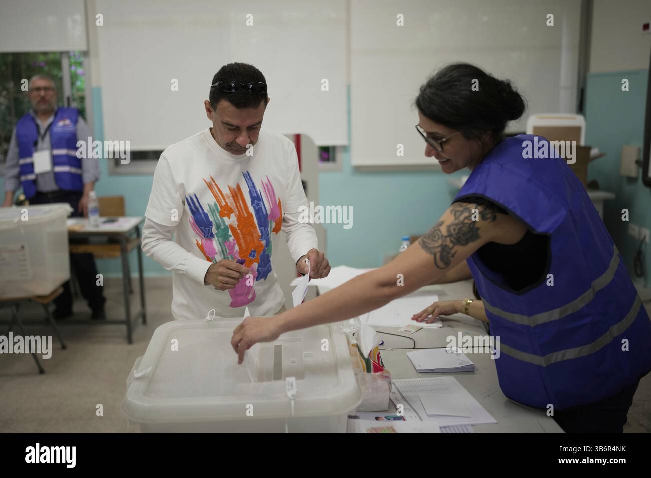 A Lebanese man casts his ballot at a polling station during municipal ...