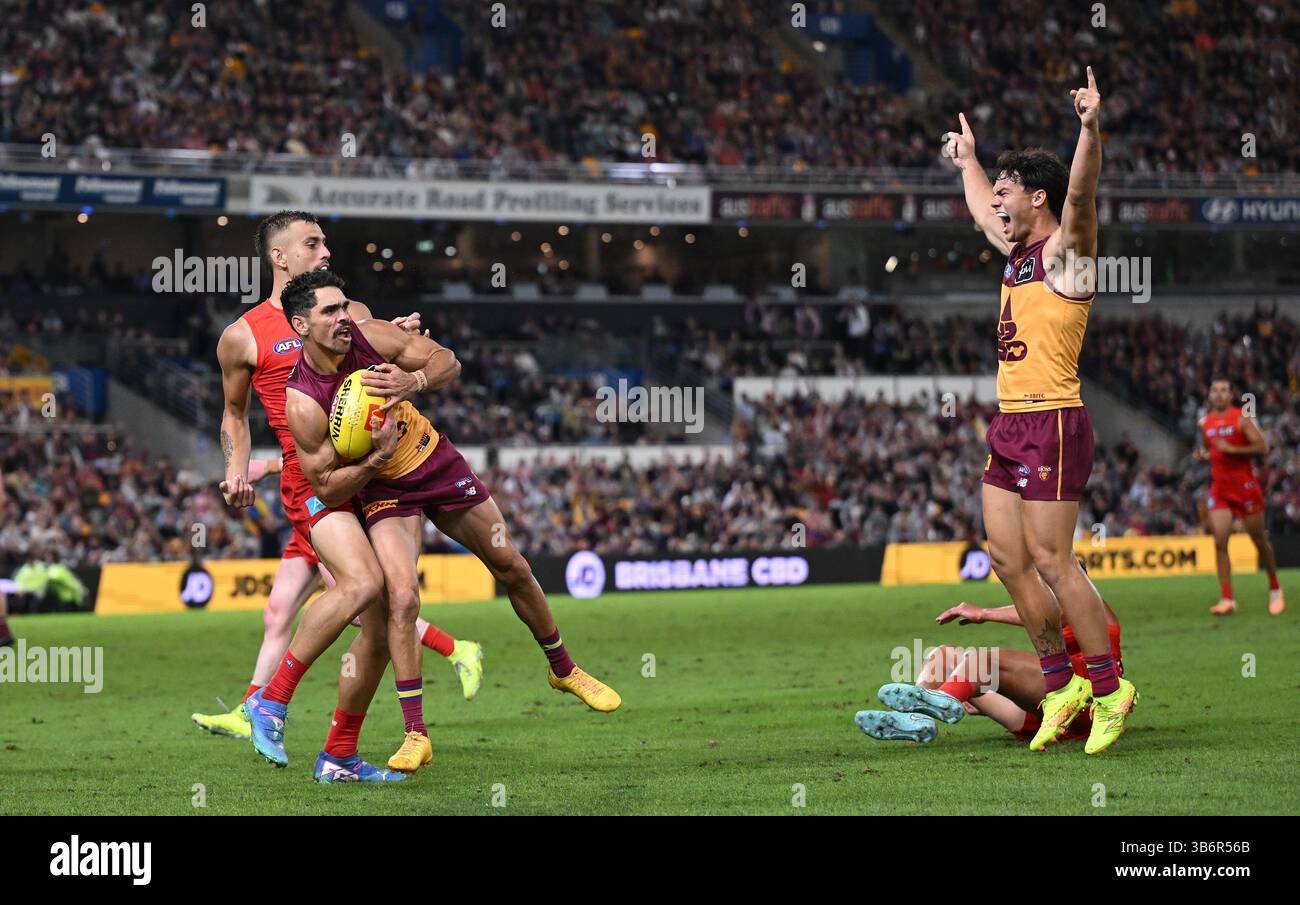 Cam Rayner of the Lions (right) reacts after Charlie Cameron took a ...
