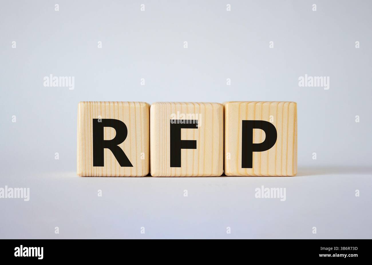 RFP - Request for Proposal. Wooden cubes with word RFP. Beautiful white ...