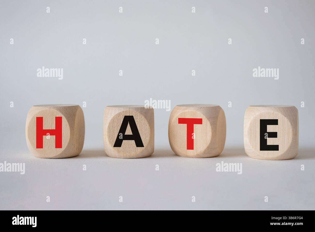 Hate symbol. Concept word Hate on wooden cubes. Beautiful white ...