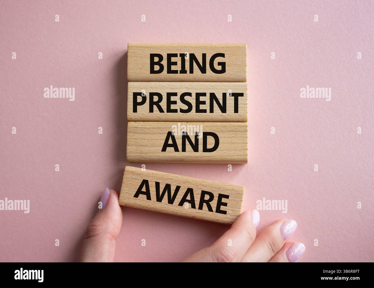 Being Present and Aware symbol. Wooden blocks with words Being Present ...