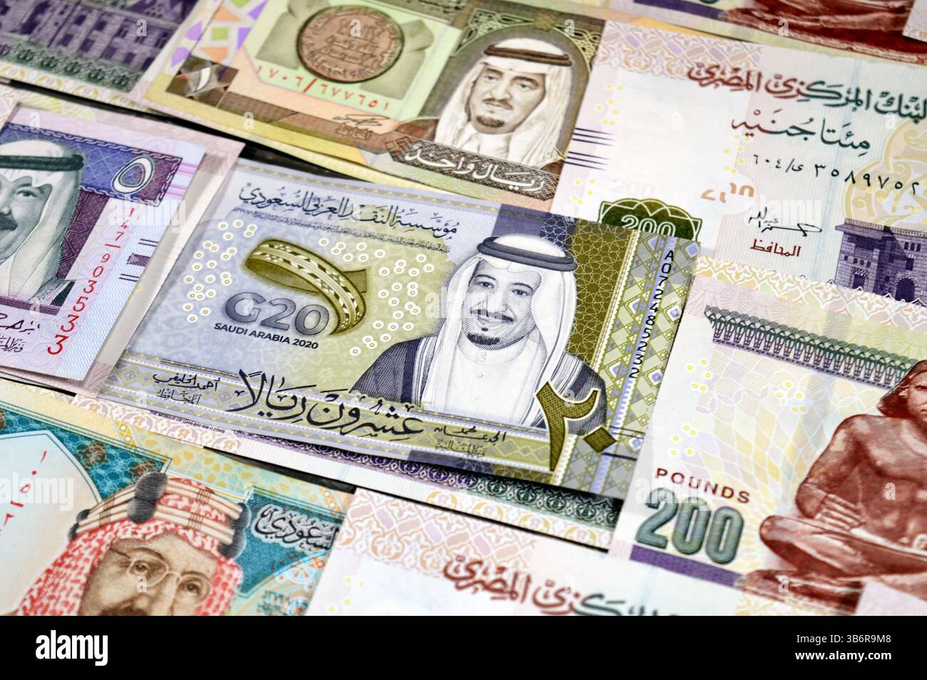 Saudi Arabia riyals SAR cash money bills banknotes and Piles of Egypt ...
