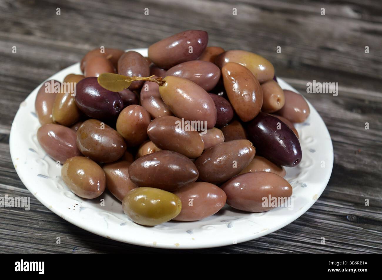 Black Olives (Olea europaea), Kalamata olive is a large, dark purple ...