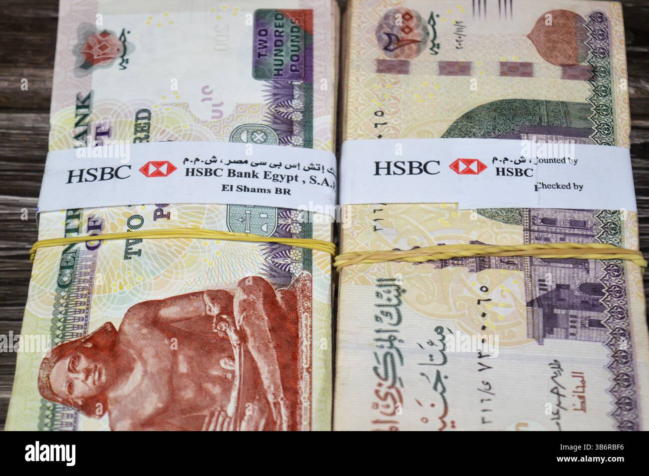 Cairo, Egypt, April 17 2025: HSBC Bank banknote binding tape on Stacks ...