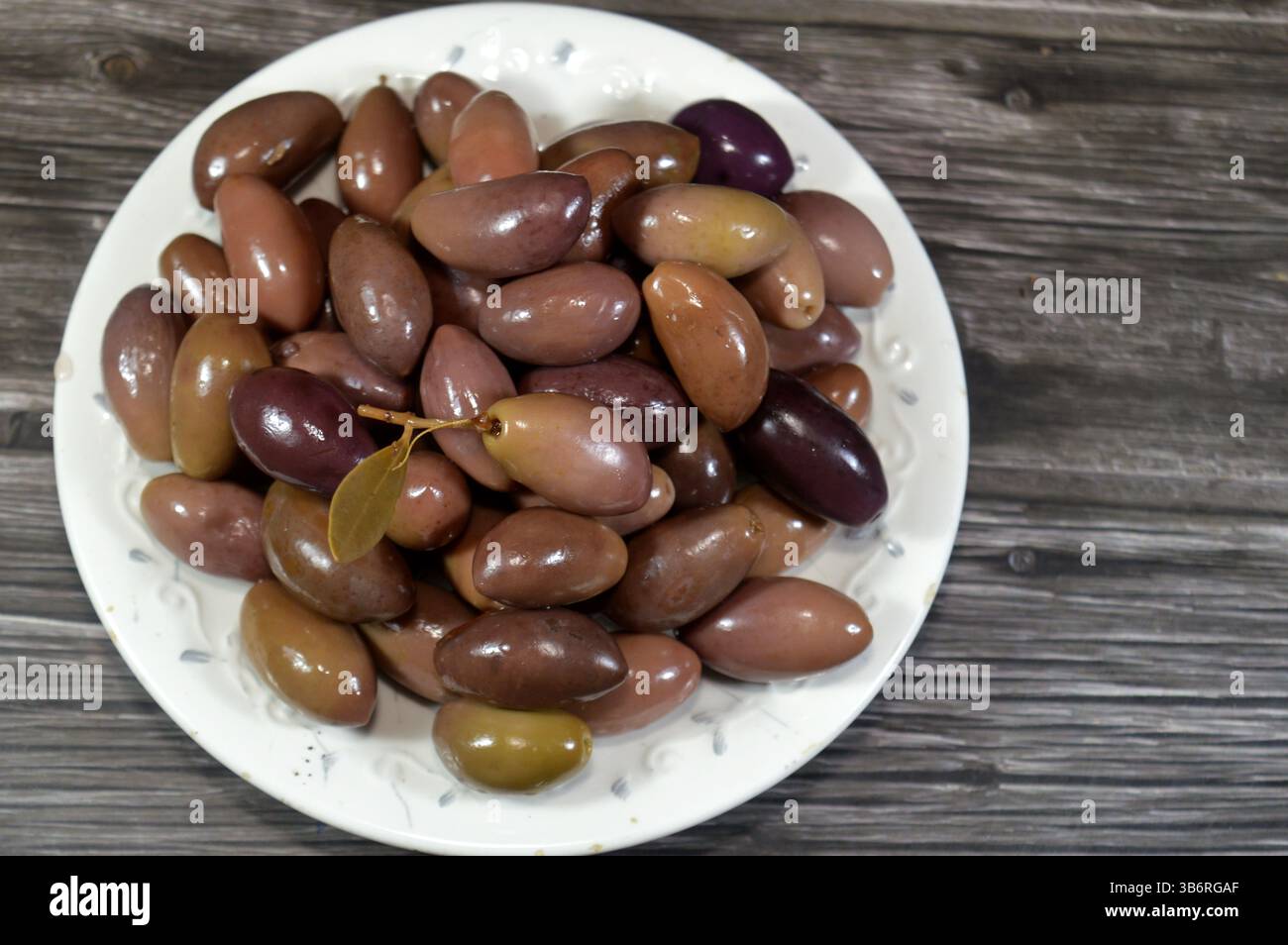 Black Olives (Olea europaea), Kalamata olive is a large, dark purple ...