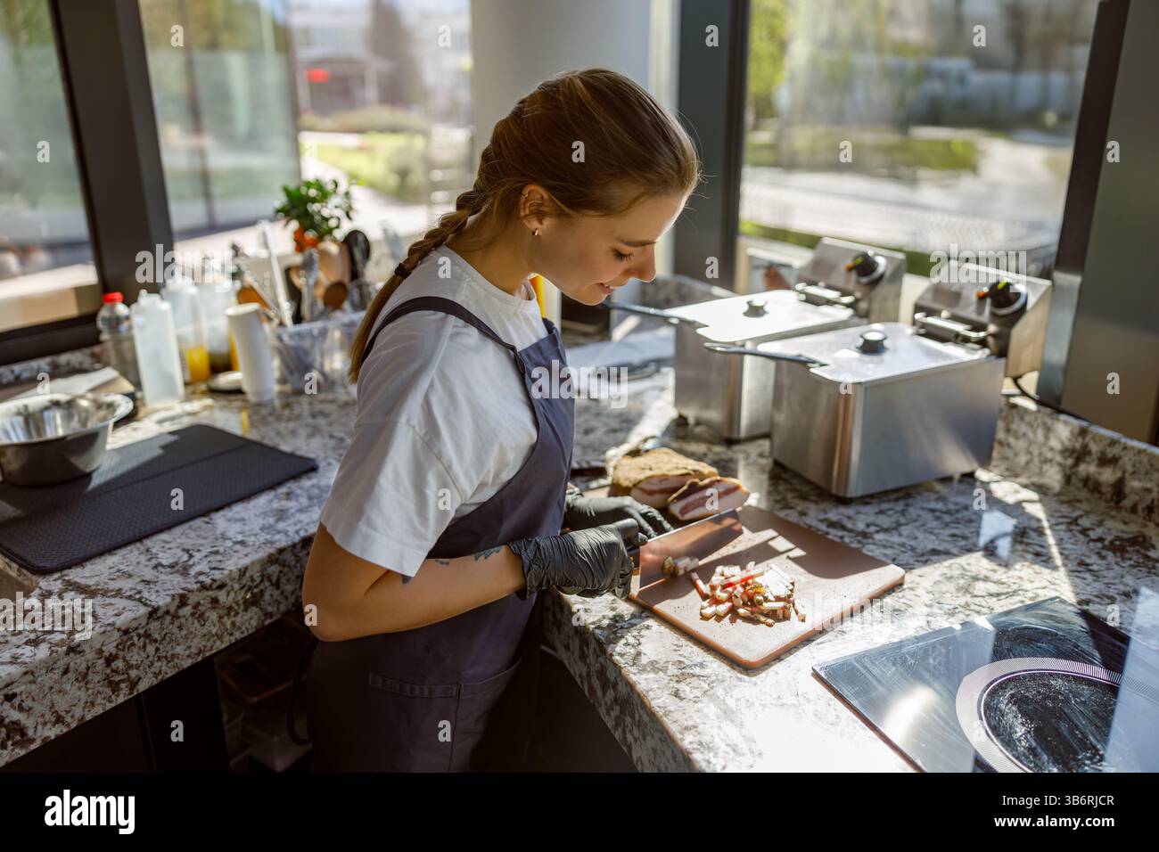 Culinary Focus A Talented Chef Preparing Fresh Ingredients in a Modern ...
