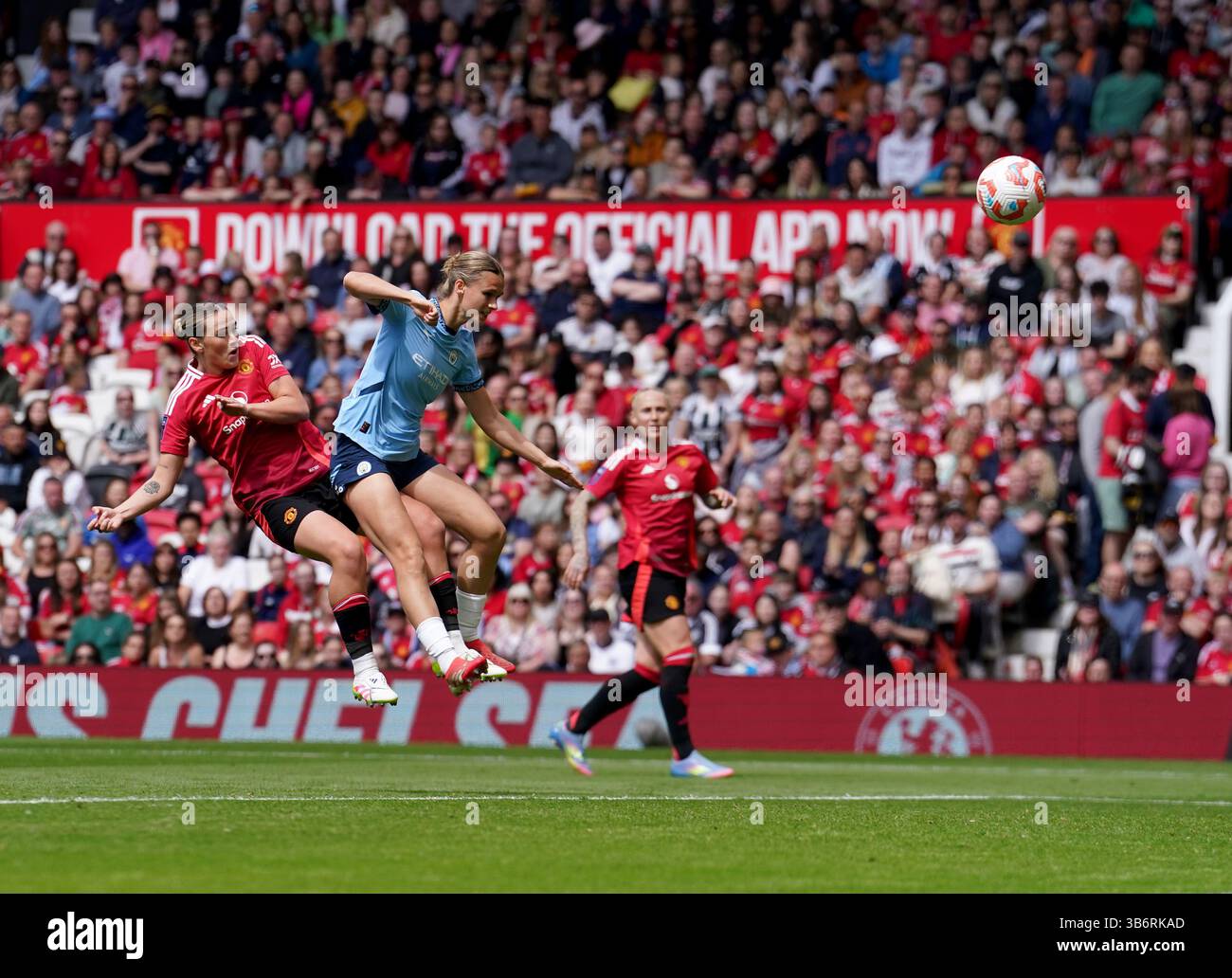 Manchester United's Grace Clinton (left) scores her sides first goal ...