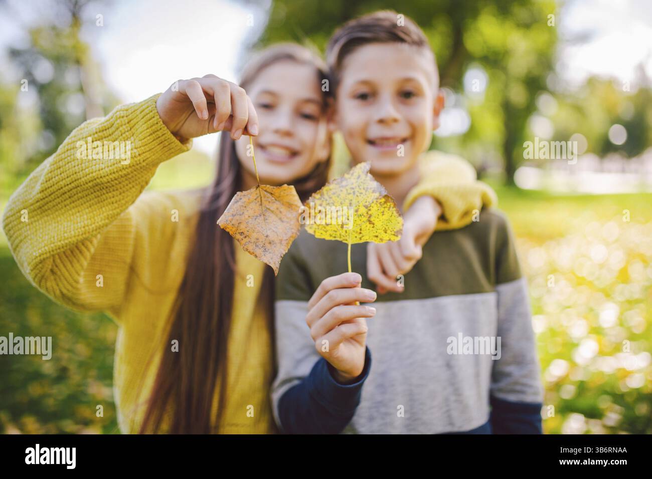 Friendship between siblings. Siblings together outside with bright ...