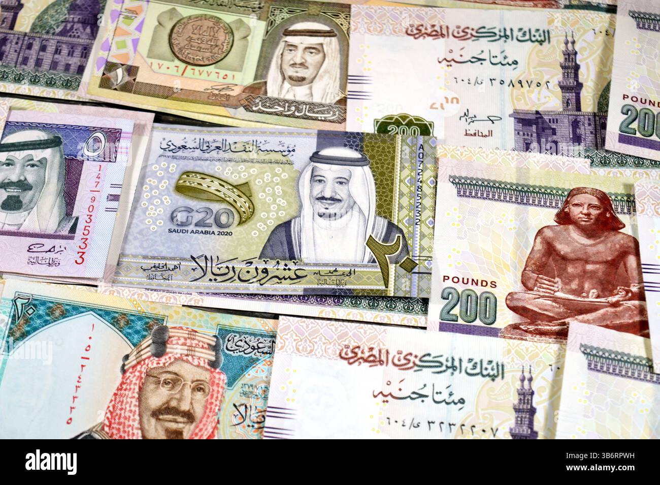 Saudi Arabia riyals SAR cash money bills banknotes and Piles of Egypt ...
