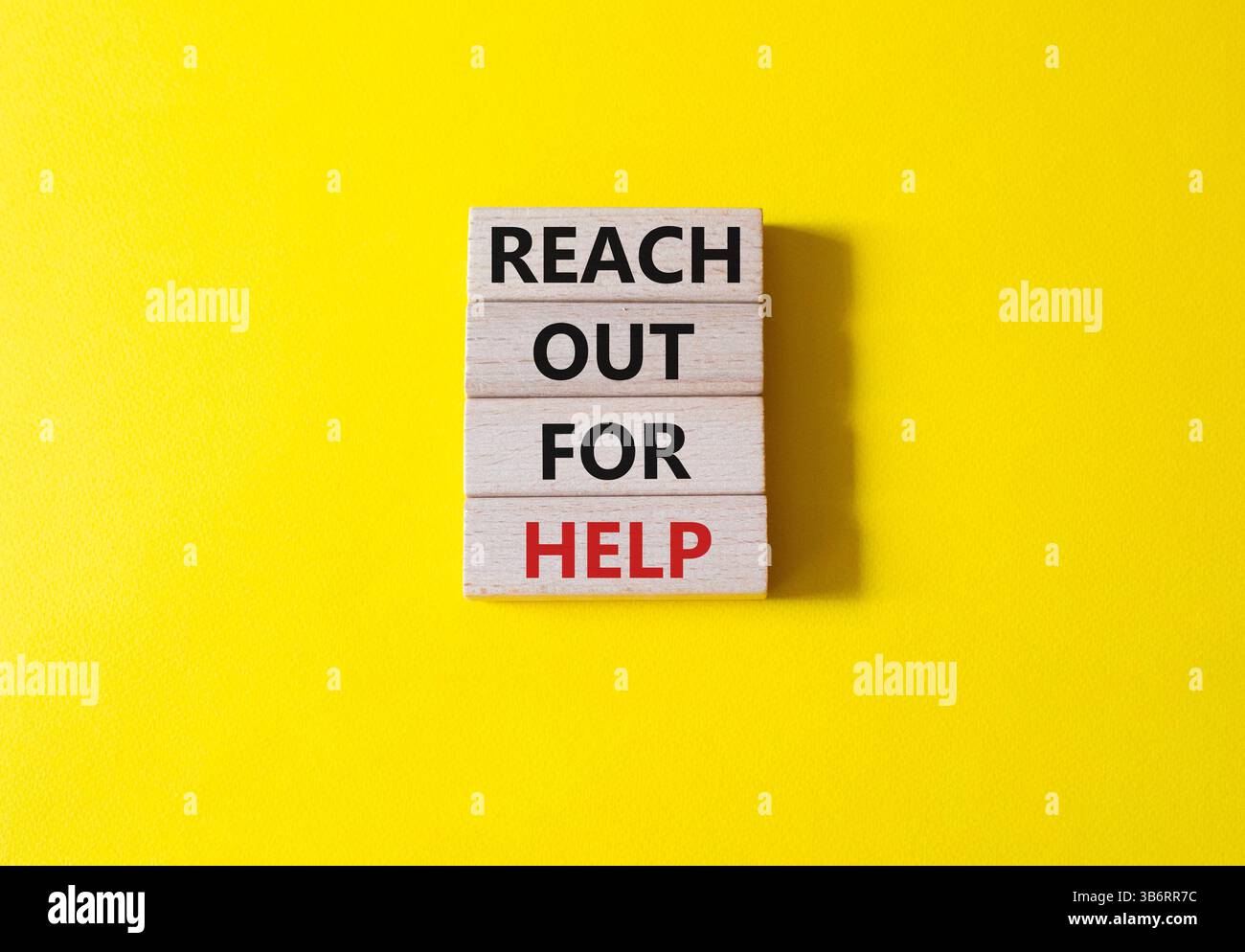 Reach out for help symbol. Wooden blocks with words Reach out for help ...