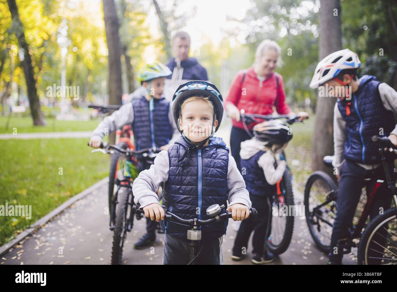 Theme family sports holiday in park in nature. big friendly Caucasian ...