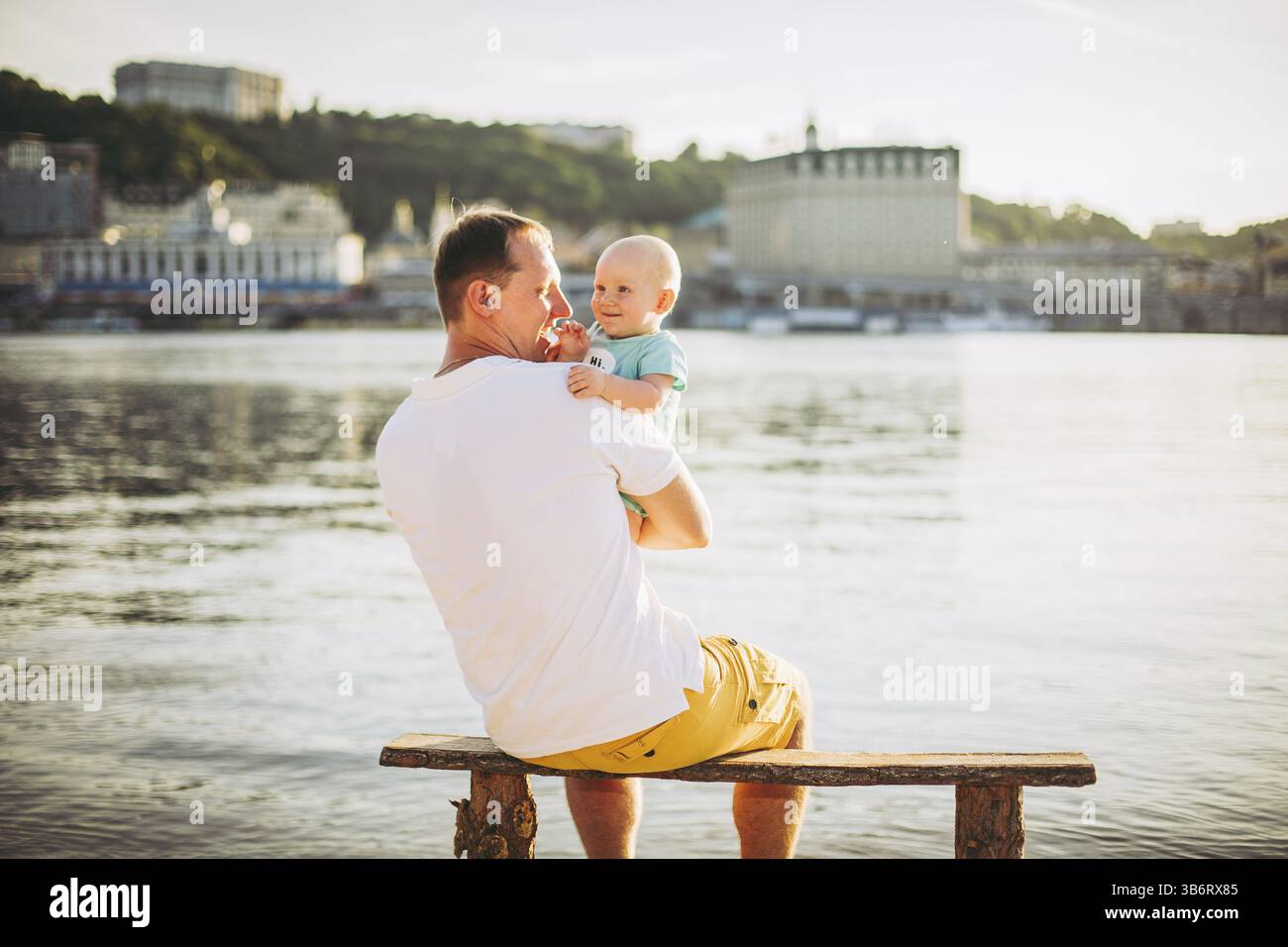 Dad hugging little baby hi-res stock photography and images - Alamy