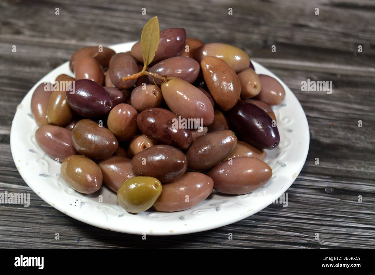Black Olives (Olea europaea), Kalamata olive is a large, dark purple ...