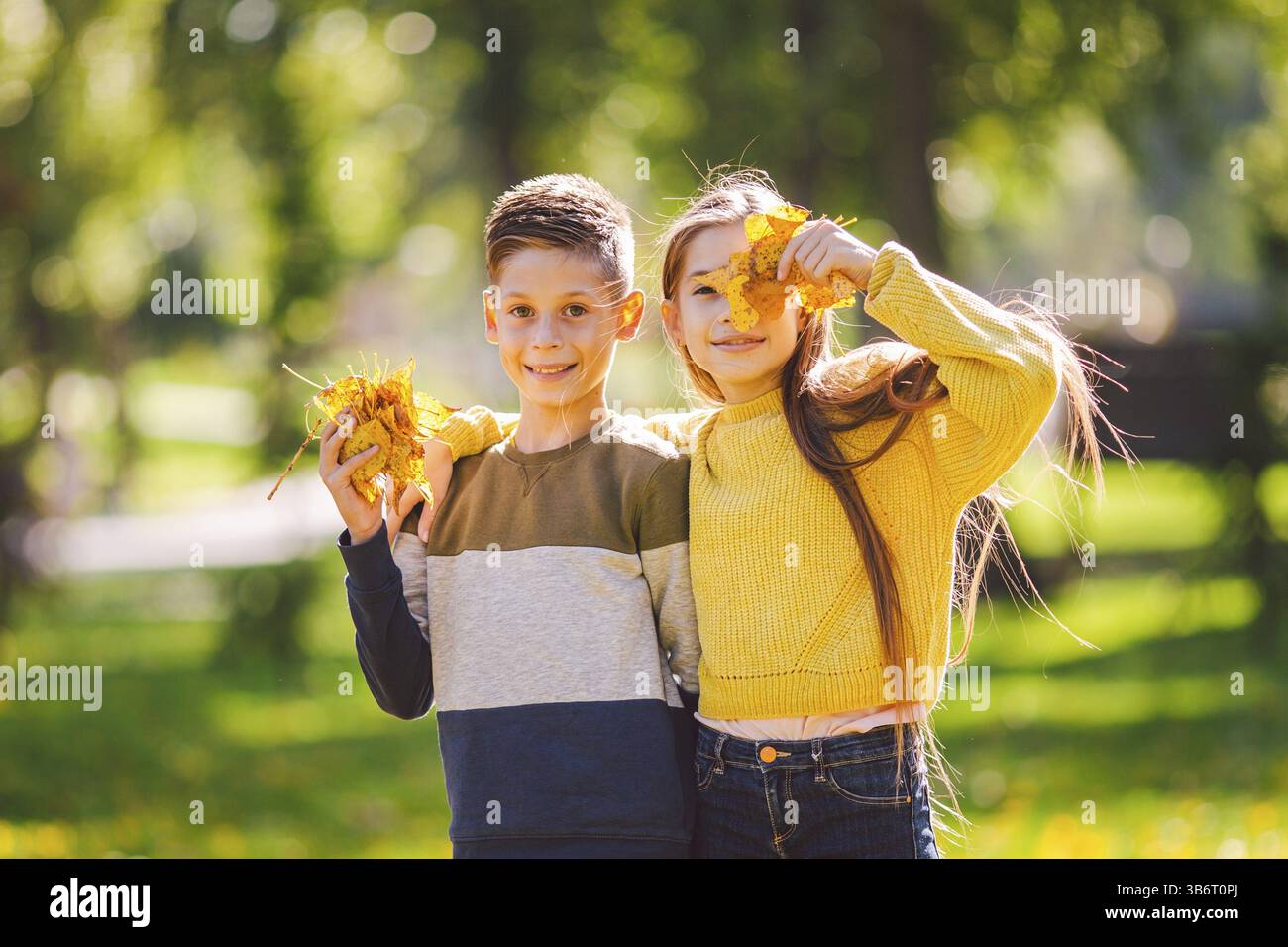 Friendship between siblings. Siblings together outside with bright ...